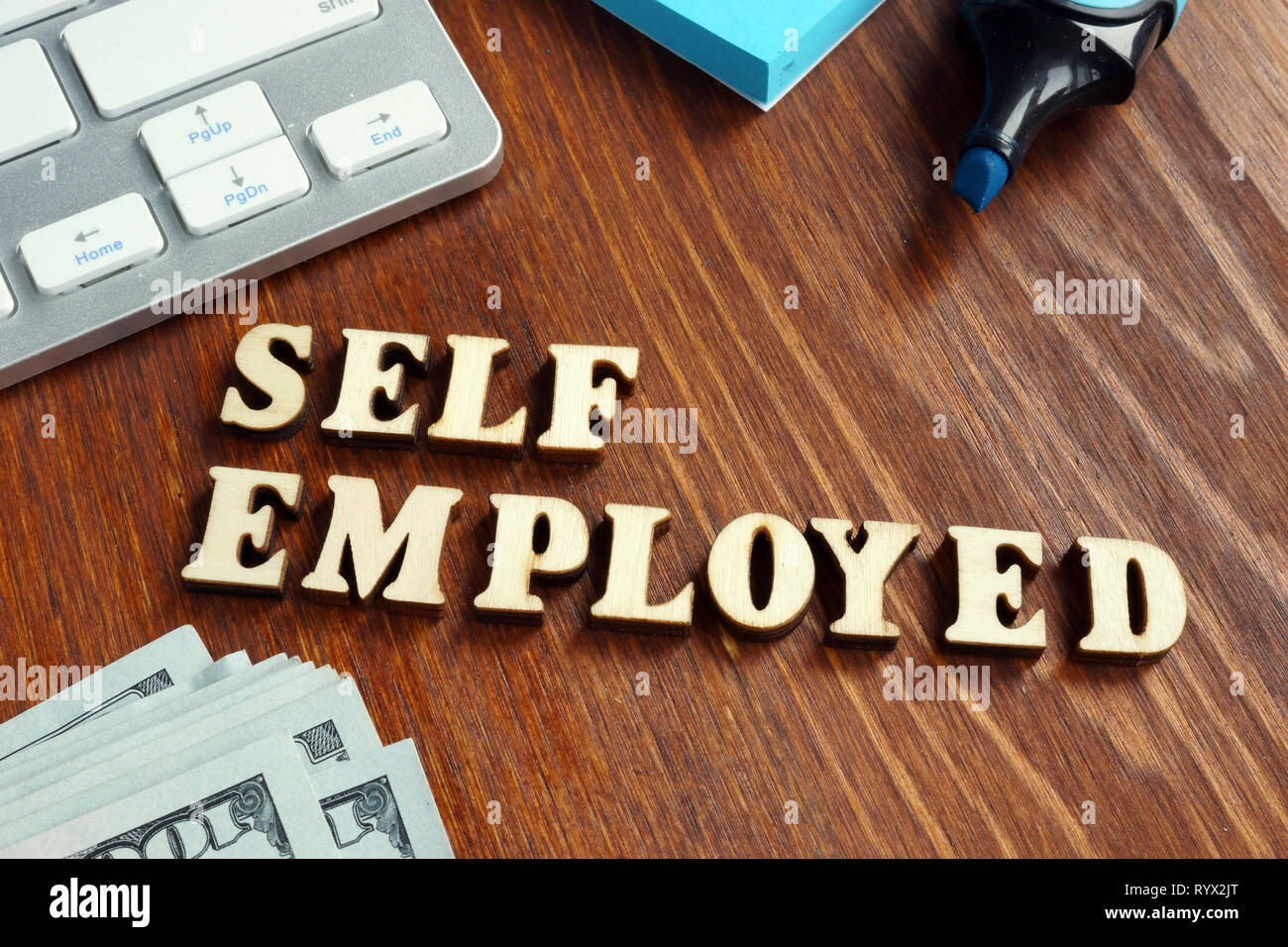 Word self employed on an office desk Stock Photo - Alamy
