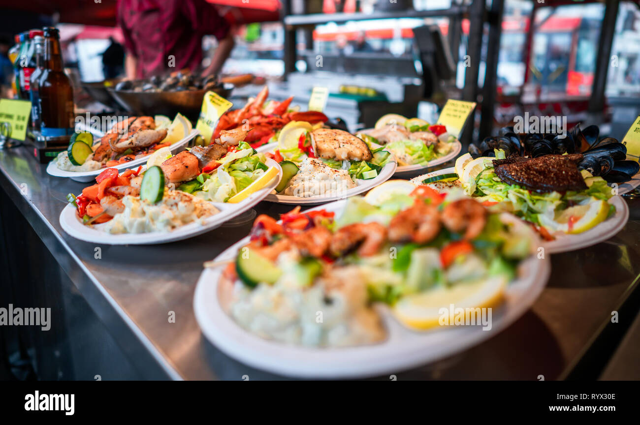 Various seafood on the shelves of the fish market in Norway, Bergen ...