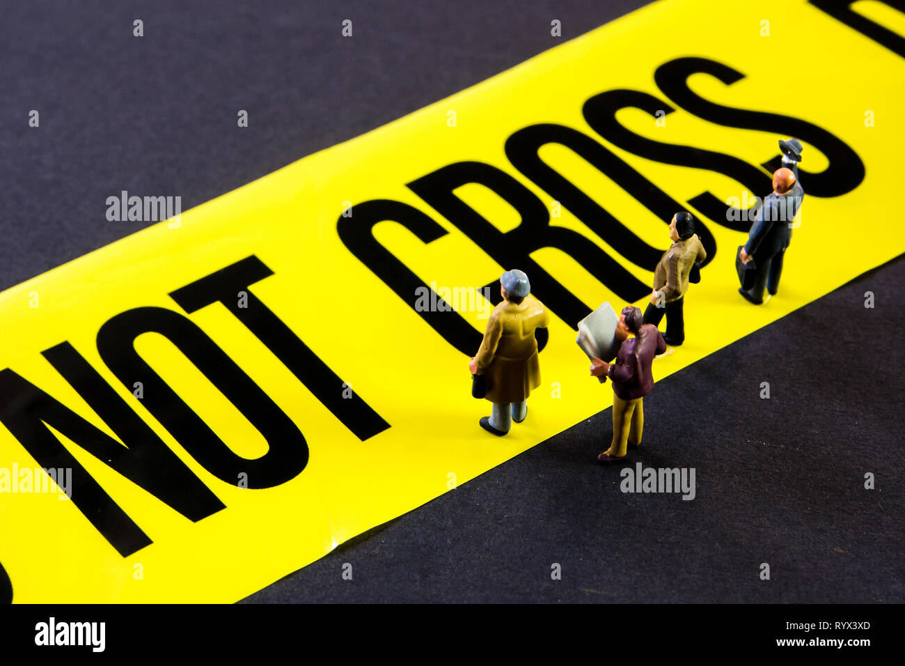 do not cross line with little miniature figurines standing in front of ...