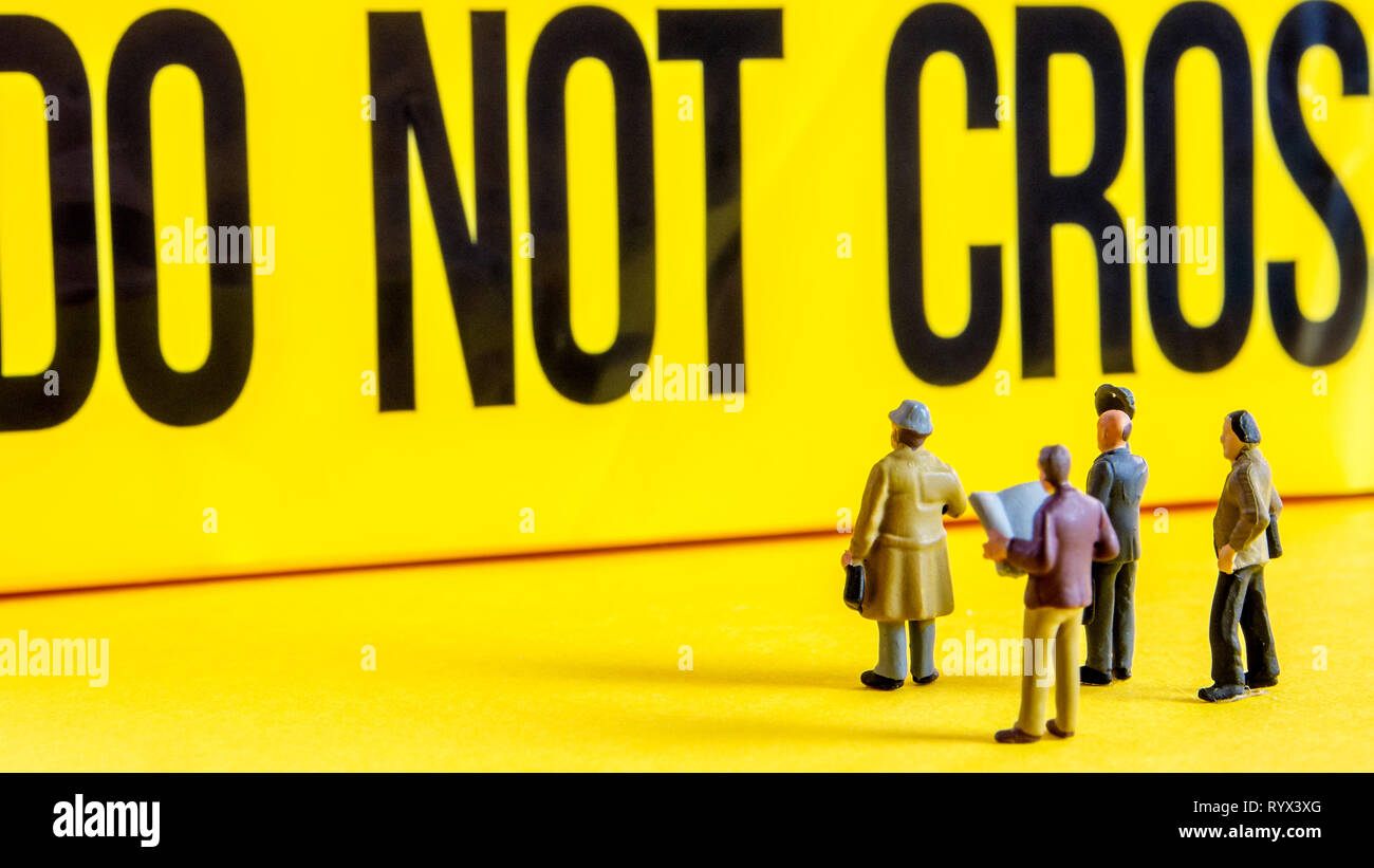 do not cross line with little miniature figurines standing in front of ...