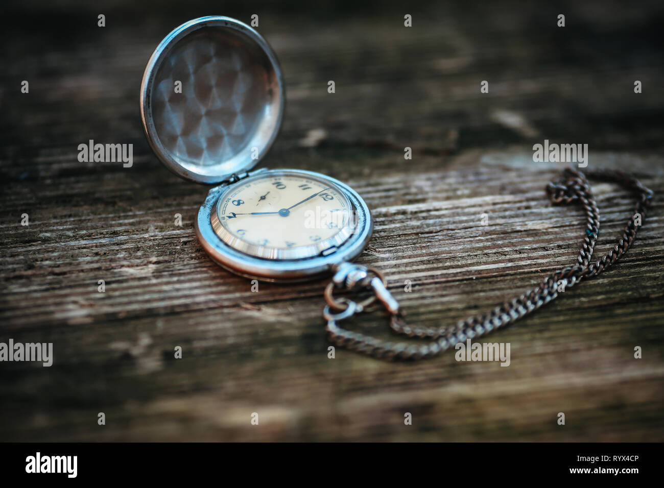 retro clock on a rope on a beautiful background Stock Photo - Alamy
