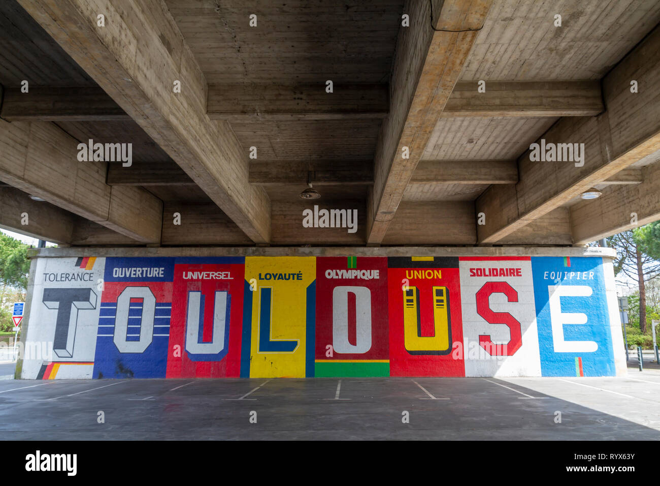 Toulouse city name painted under a big concrete bridge Stock Photo - Alamy