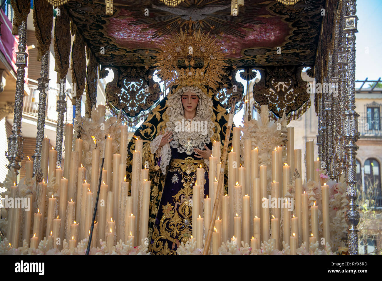 Holy Week procession of a float featuring the Virgin Mary and large ...