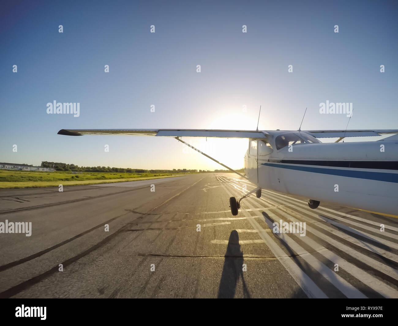 Small airplane taking off from the Runway at an airport during a ...