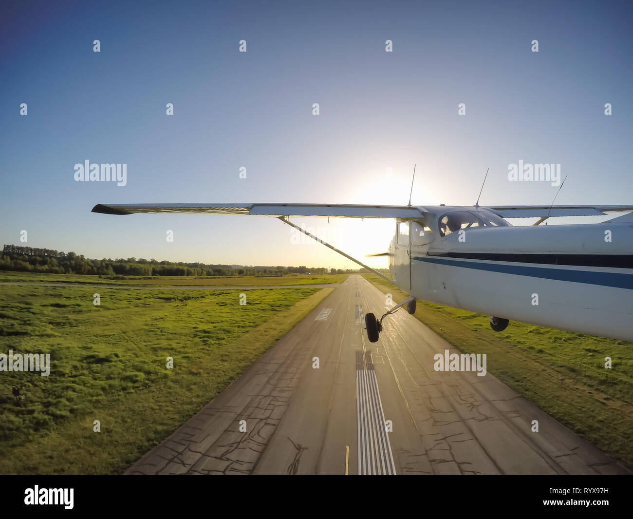 Small airplane taking off from the Runway at an airport during a ...