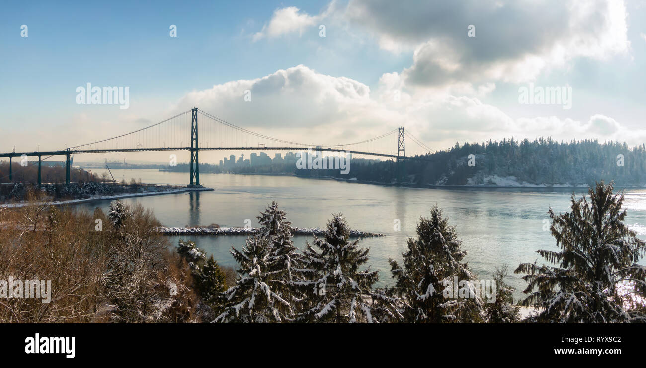 Aerial panoramic view of Lions Gate Bridge during a vibrant winter day ...