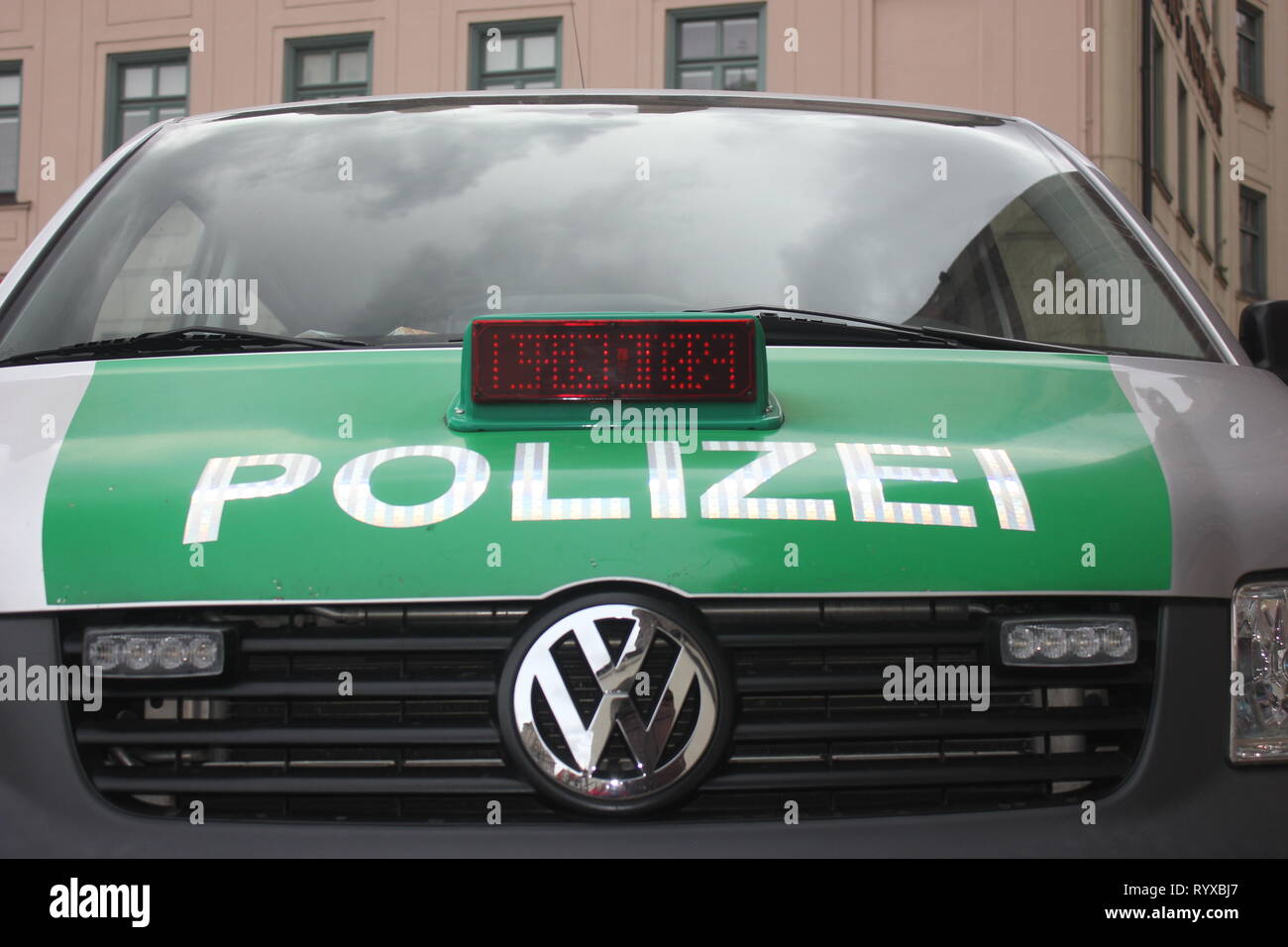 German police car, green white, digital display on board with lettering ...