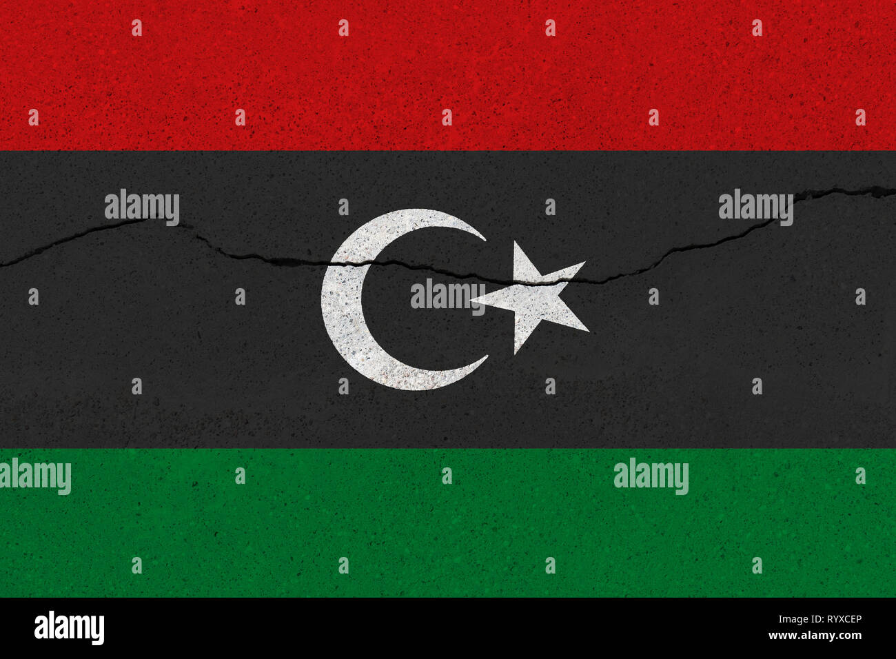 libya flag on concrete wall with crack. Patriotic grunge background ...