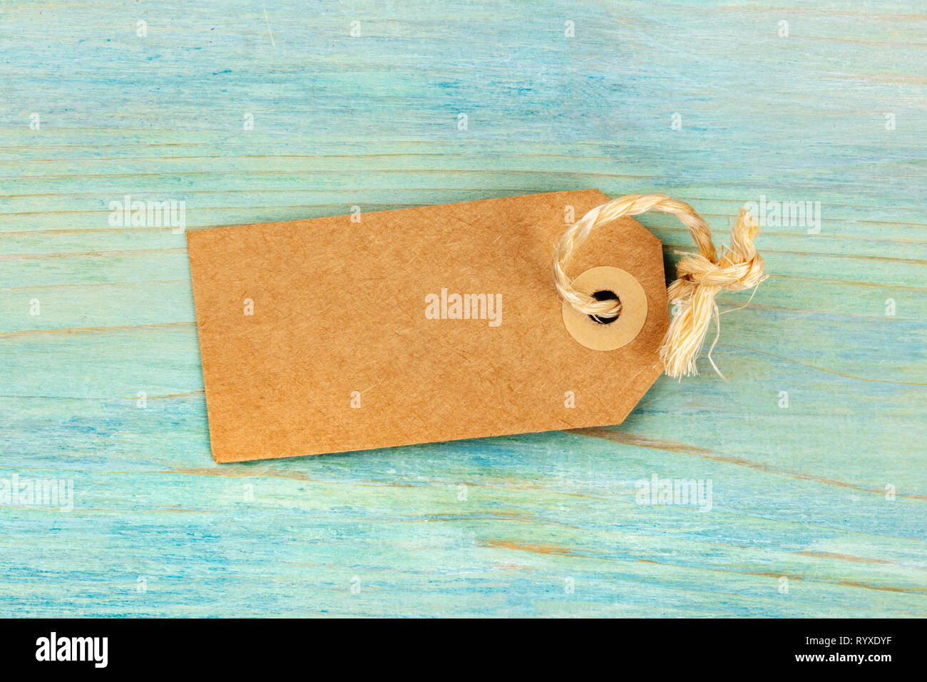 A photo of a brown kraft paper label. A price tag shot from the top on ...