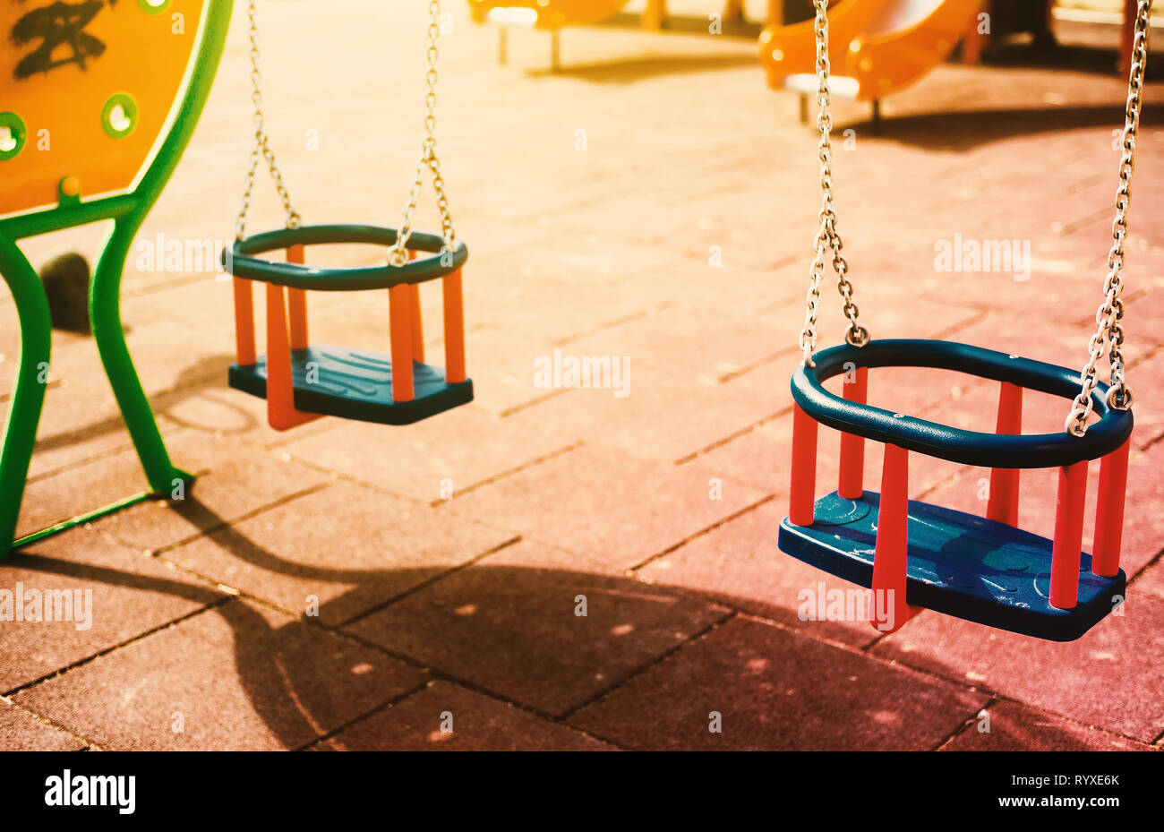 Details of modern and colorful rocking chair, scene from park during ...