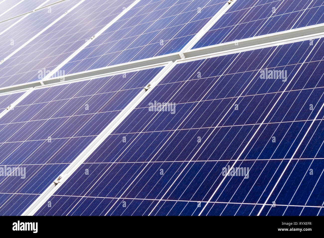 Closeup on solar cell photovoltaic panels at energy production plant ...
