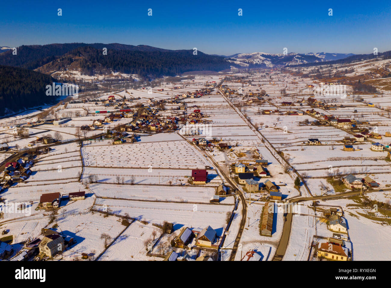 Aerial winter landscape of a traditional romanian village, Moldovita ...