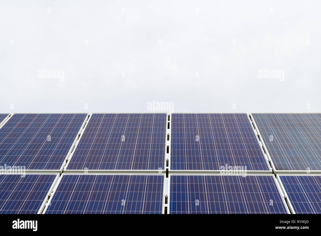 Solar cell photovoltaic panels at energy production plant with blue ...