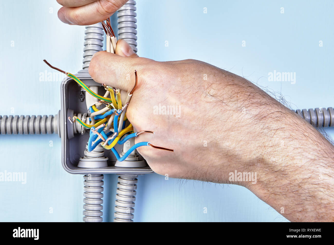 Hand holding electrical wires hi-res stock photography and images - Alamy