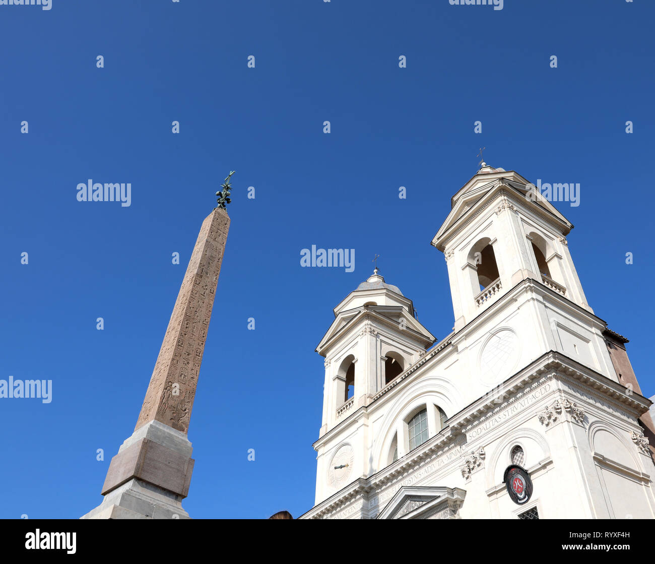 Ancient Egyptian obelisk with hieroglyphs and Trinity Church of the ...