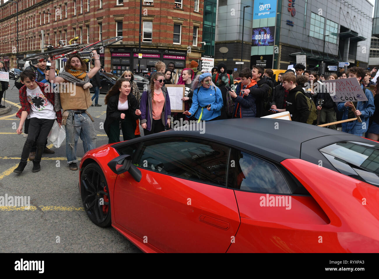 Manchester, UK, 15th March 2019. Pupils from schools across Manchester ...