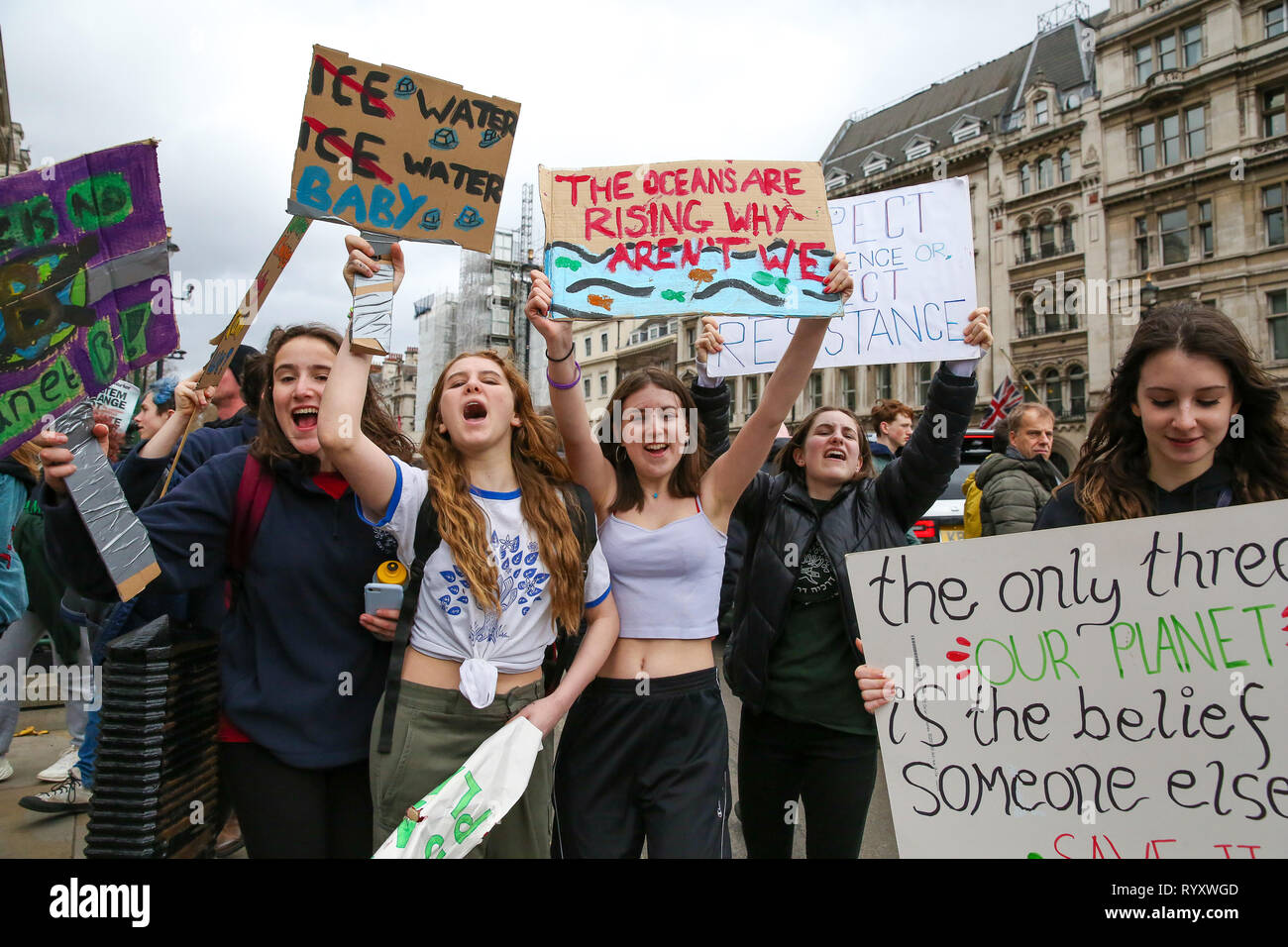 Students are seen with placards shouting slogans taking part in a ...