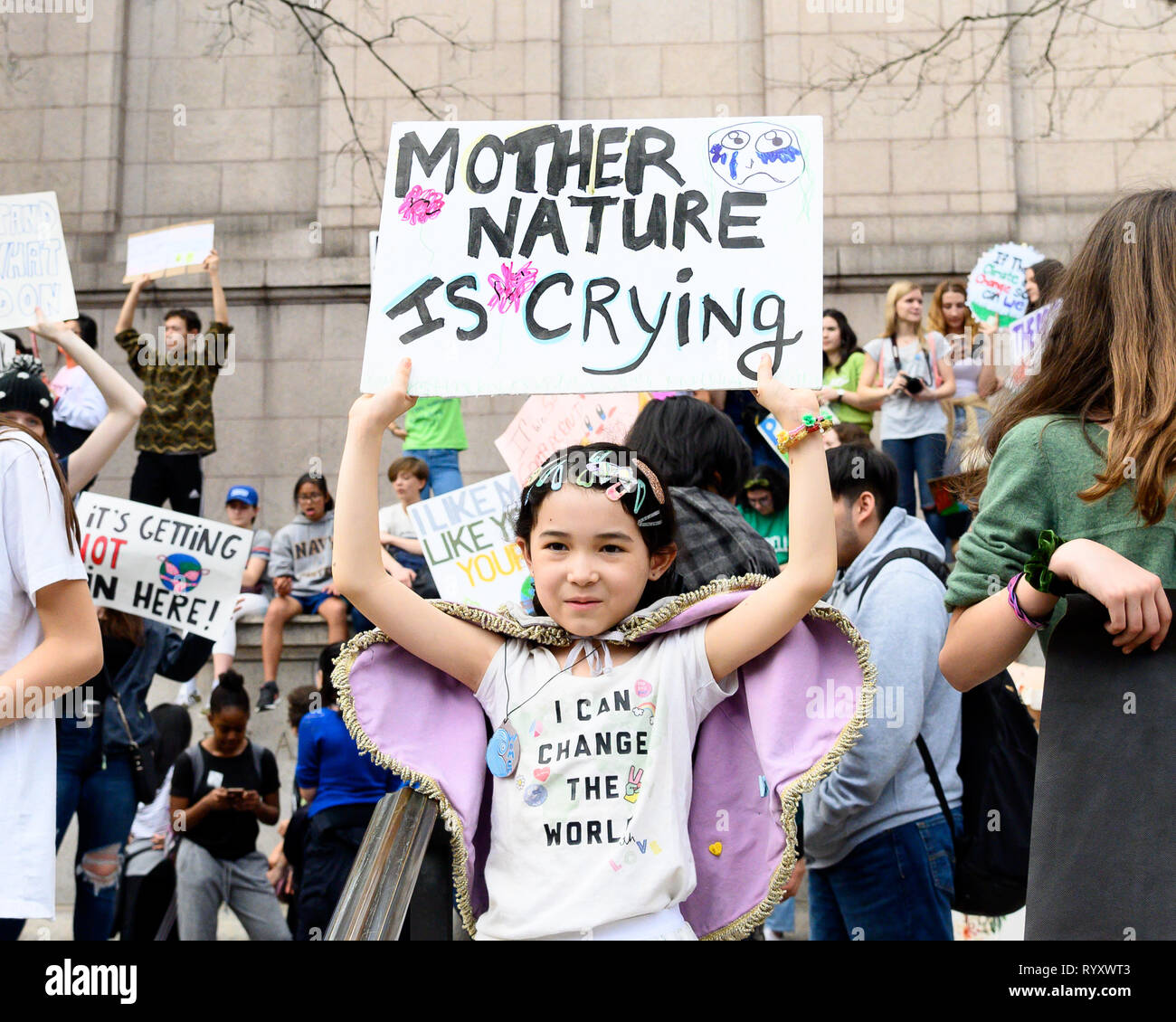 A kid seen holding a placard saying, mother nature is crying, during ...