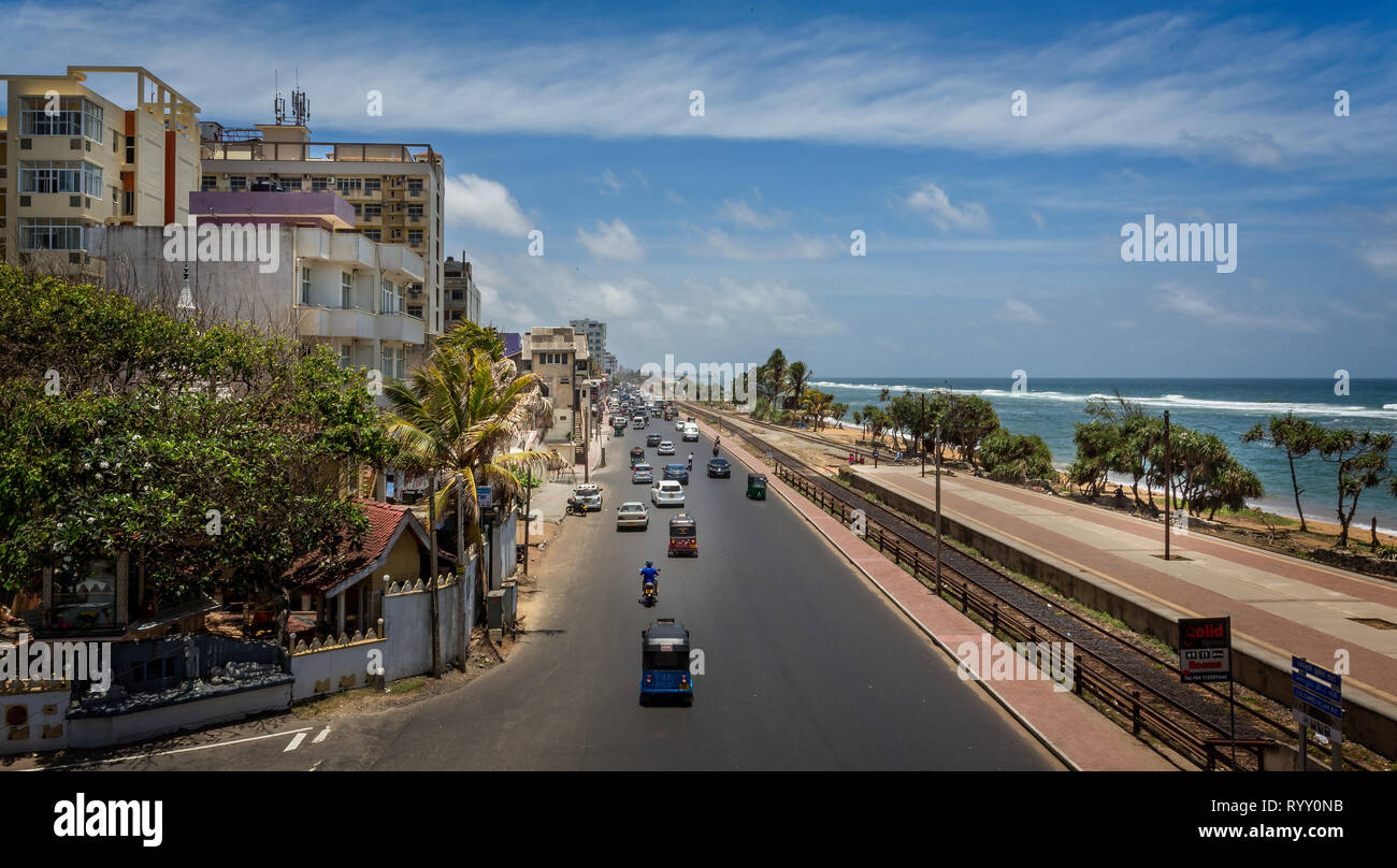 Busy street in Colombo running along railway and coast in Colombo, Sri ...