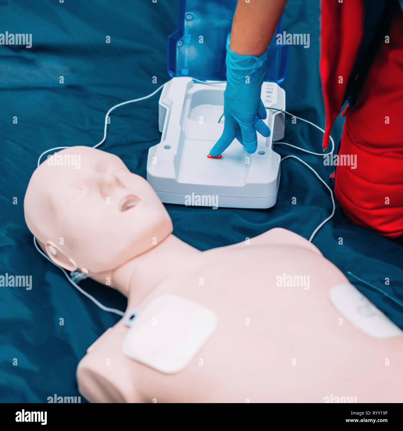 Defibrillator training outdoors Stock Photo - Alamy