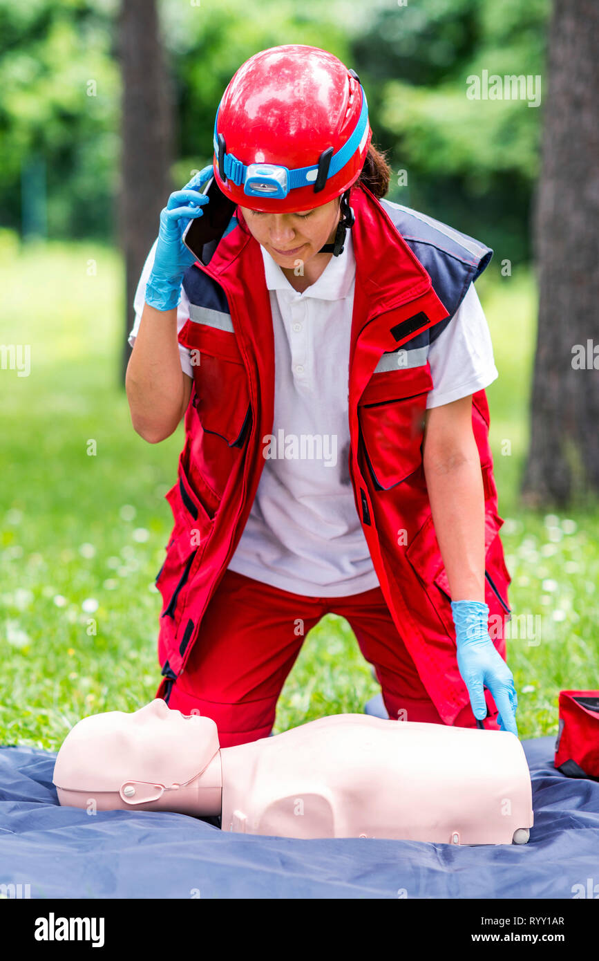 First aid instructor demonstrating check hi-res stock photography and ...