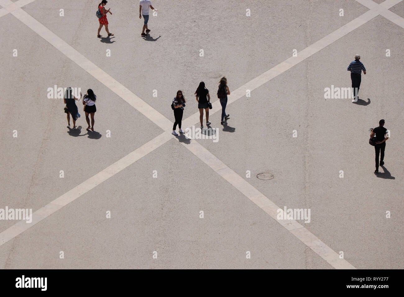 Aerial view of a group of people walking in a square Stock Photo - Alamy