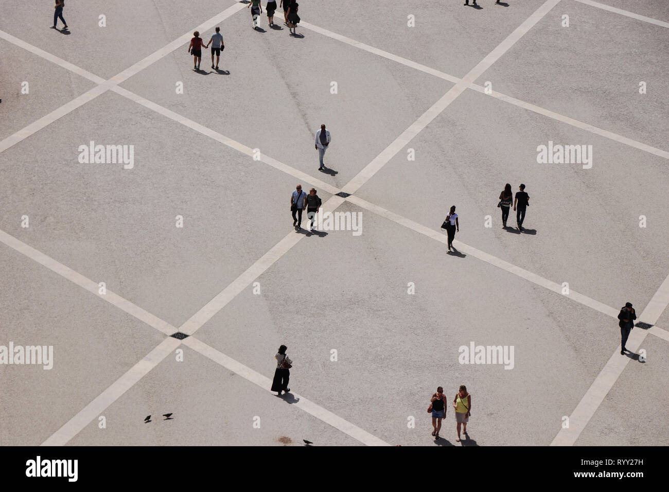 Aerial view of a group of people walking in a square Stock Photo - Alamy