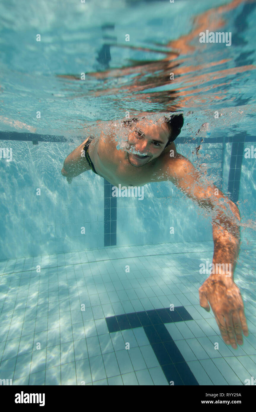 Smiling person swimming underwater hi-res stock photography and images ...