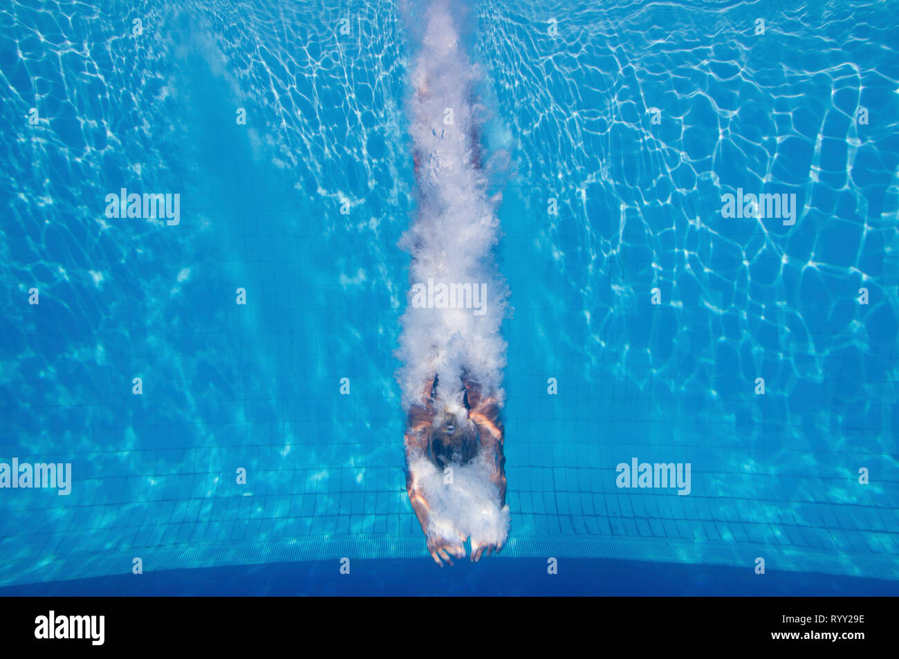 Woman diving underwater Stock Photo - Alamy