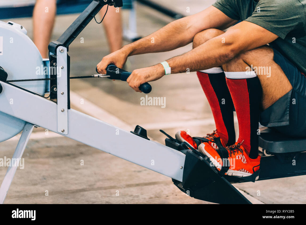 Rowing machine workout Stock Photo - Alamy
