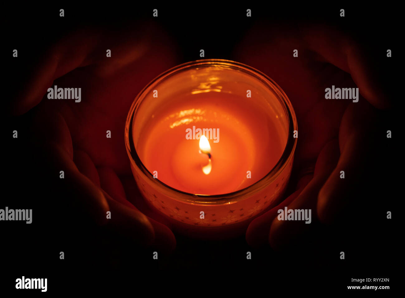 Light comes from kind hands Stock Photo - Alamy