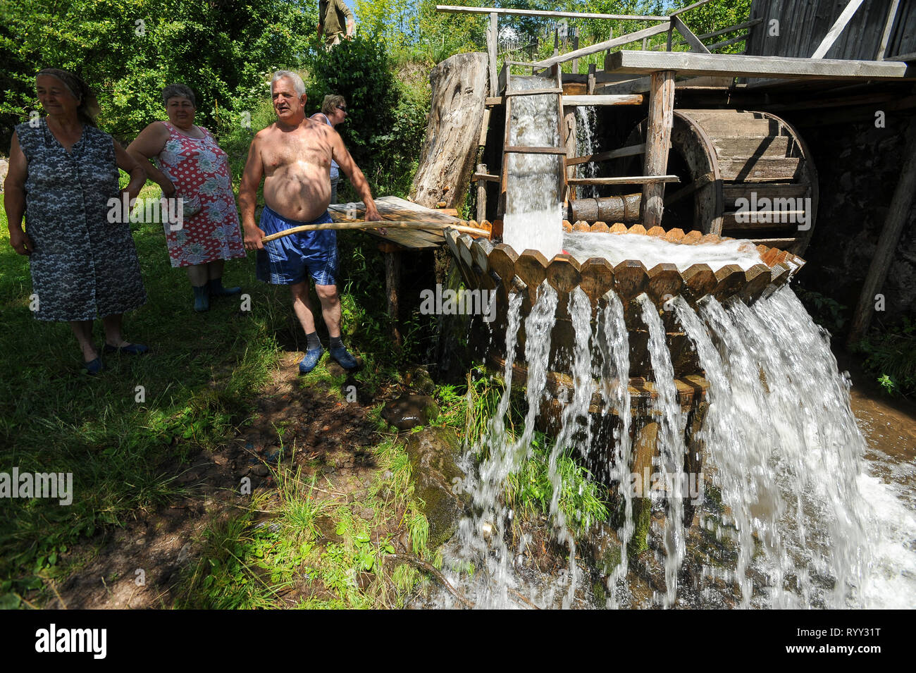 Public washing machine made from wood and built on creek in Remetea ...