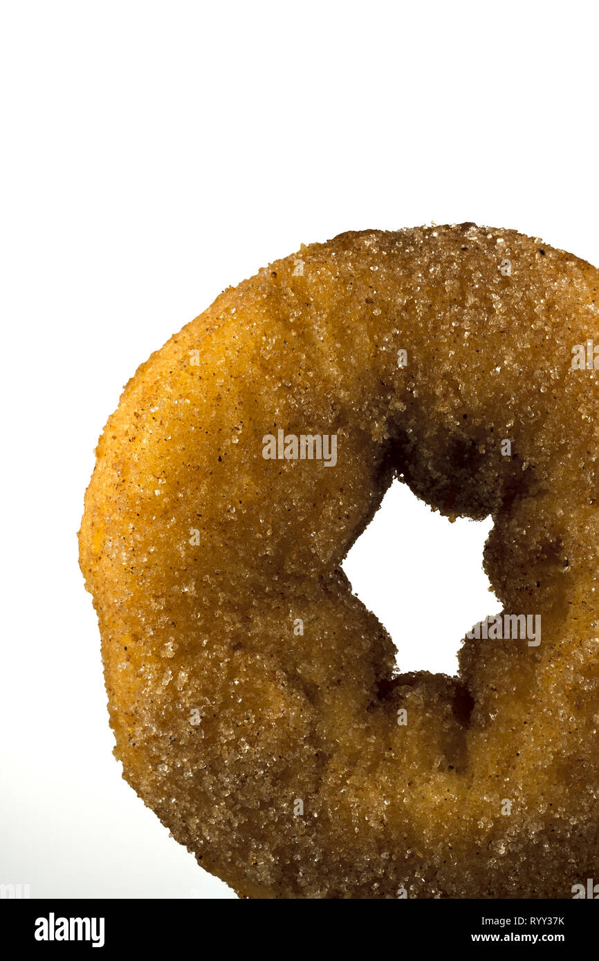 Doughnut closeup (cropped) at bottom right, on white background Stock ...