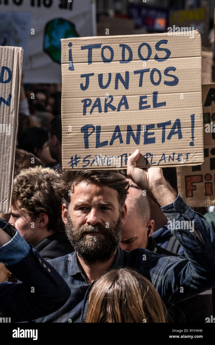 A protester is seen holding a placard saying save the planet during the ...