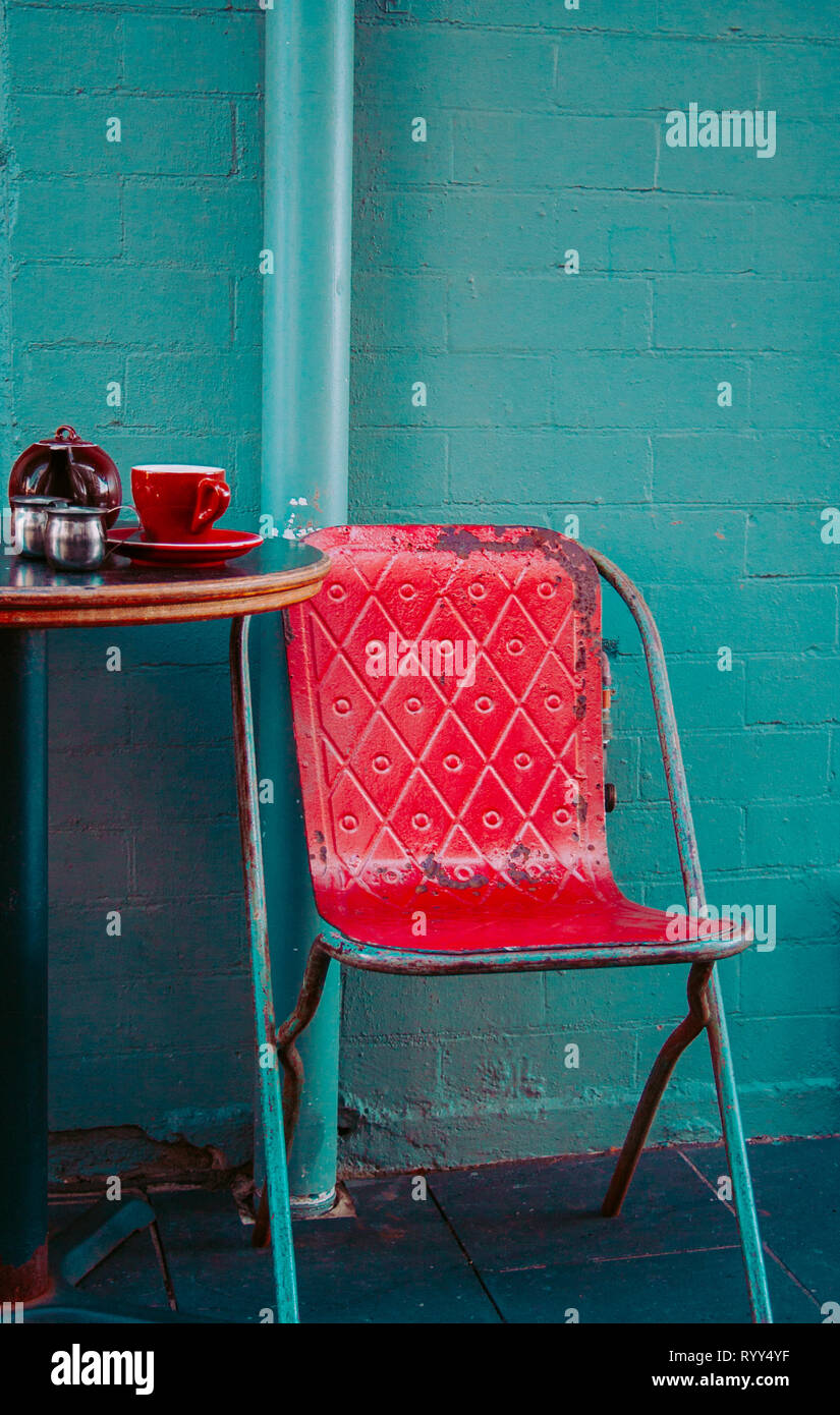 Old retro red metal chair at a cafe Stock Photo - Alamy