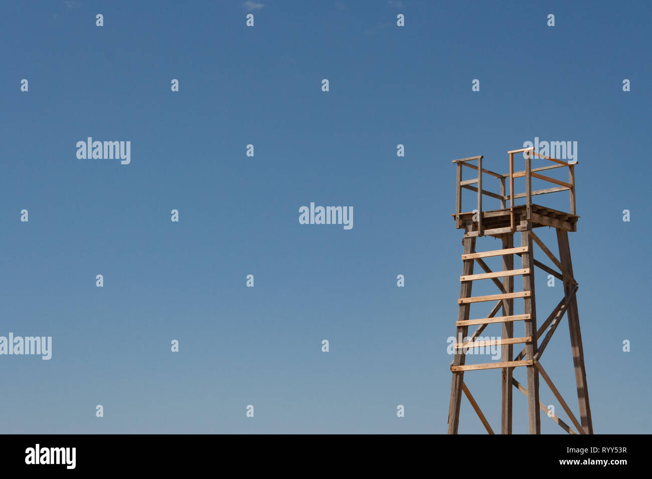 Timber lifeguard tower on rocky outcrop at the beach Stock Photo - Alamy