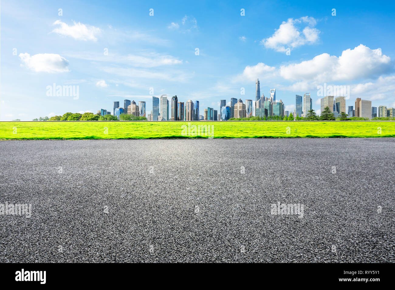 Shanghai city skyline and famous landmark buildings with empty asphalt ...