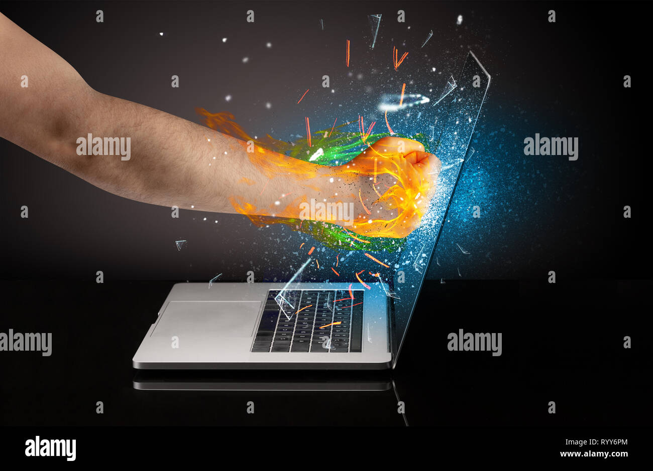 Firing hand hitting strongly laptop screen glass Stock Photo - Alamy