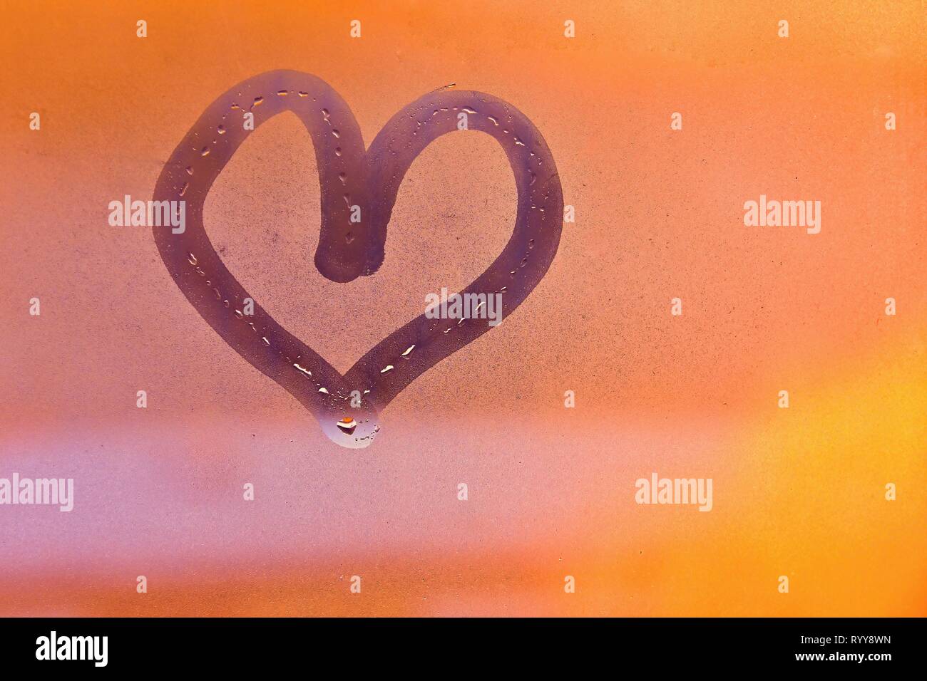 Heart painted with finger on foggy window Stock Photo - Alamy