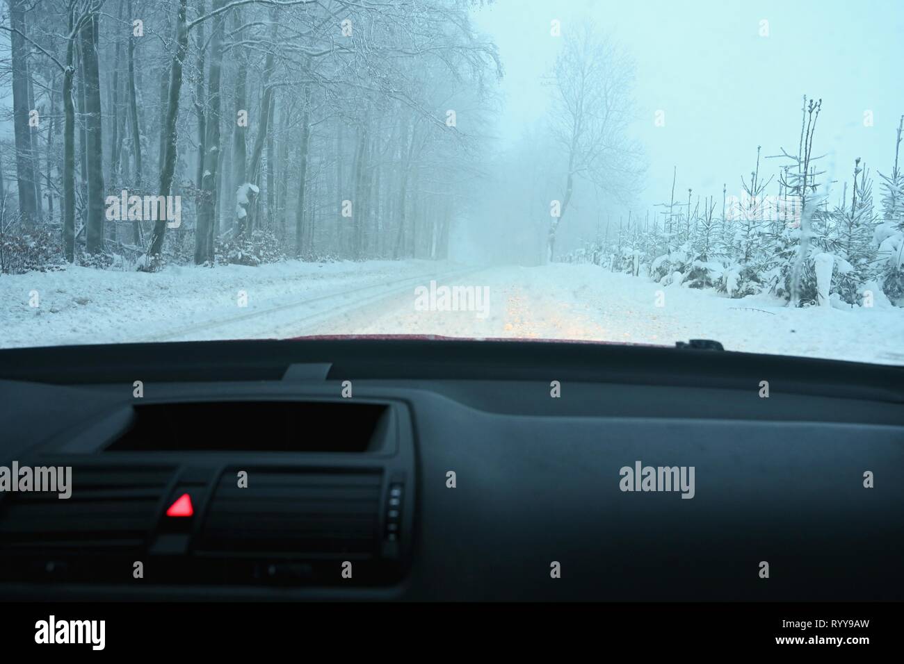 Driving the car in the winter. View from the interior of a car on a ...