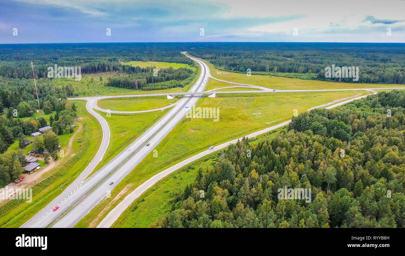 Aerial view of the road and intersections with cars passing by ...