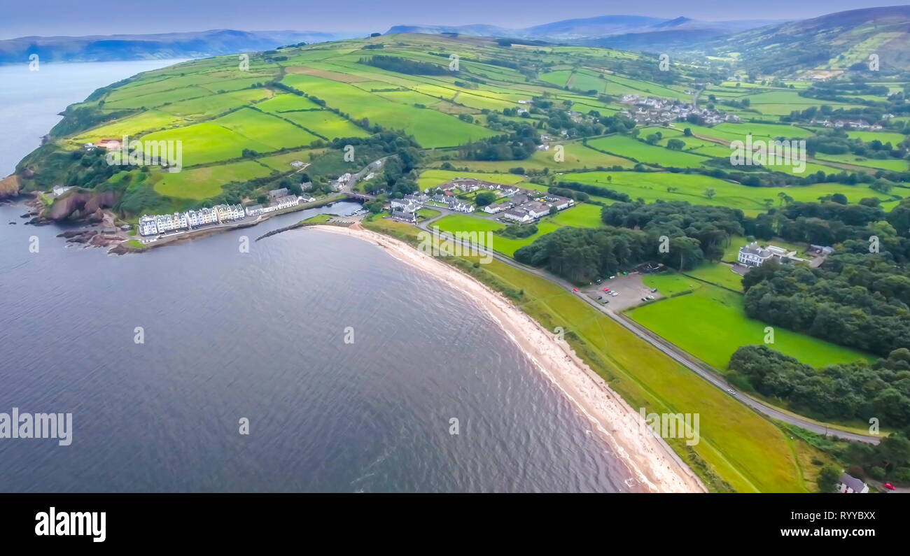 The landscape view of the green fields in Cushendun fronting the big ...