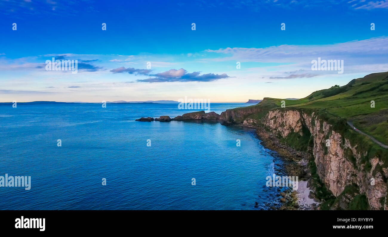 Aerial view of the Carrick-a-Rede cliff in Ireland. The bridge links ...