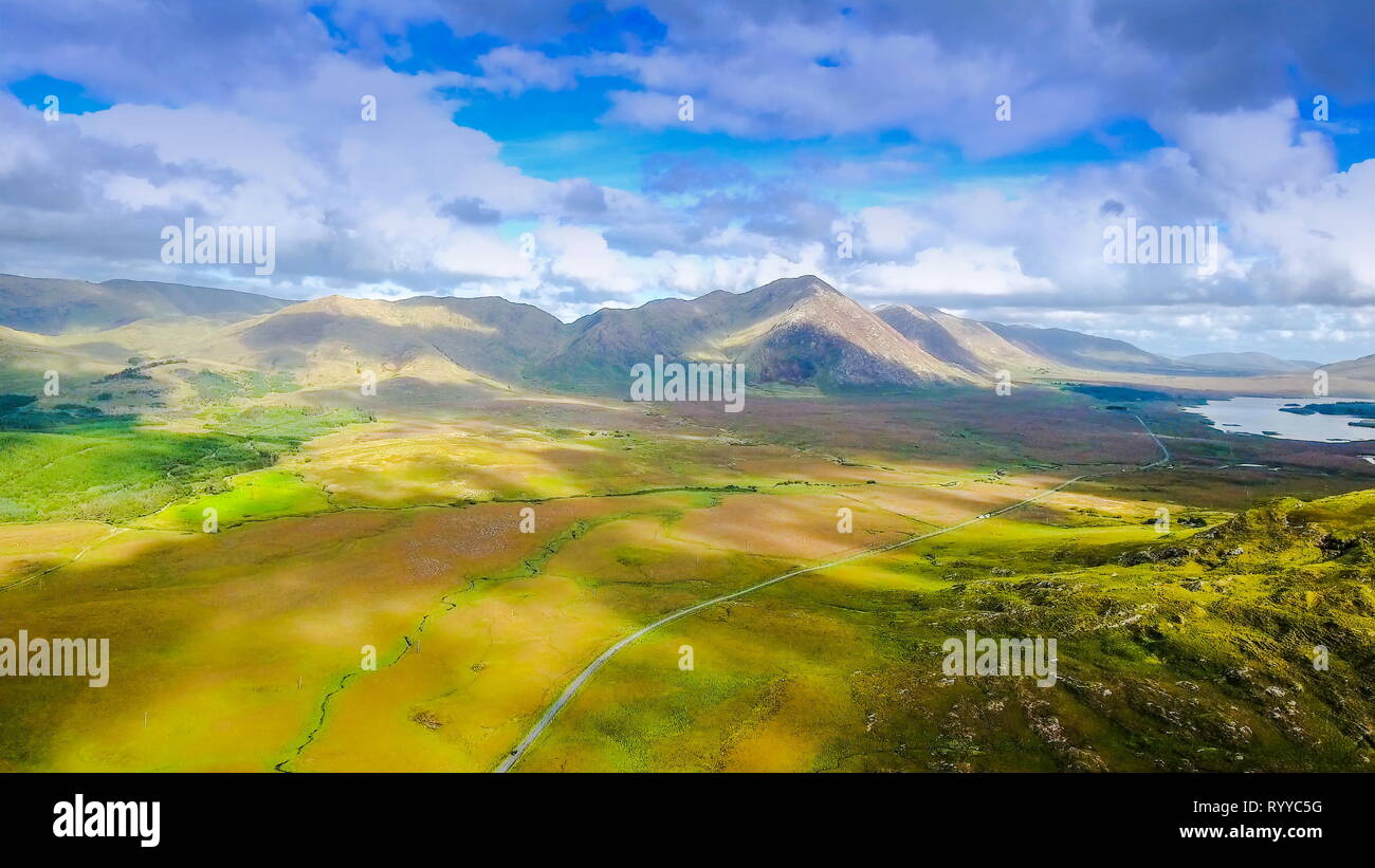 Aerial view of the Connemara National Park seen the green fields ...