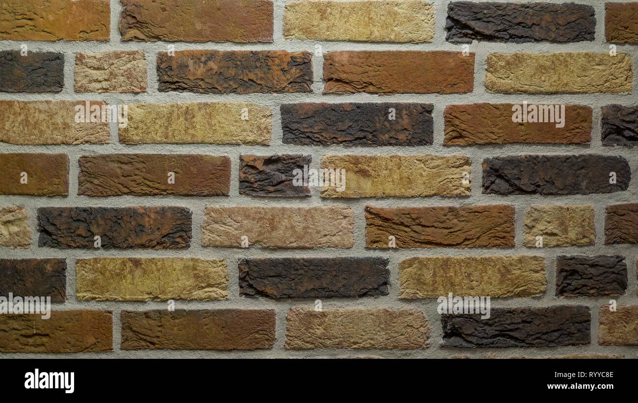 Different colored bricks in one wall of a house as a display of brick ...