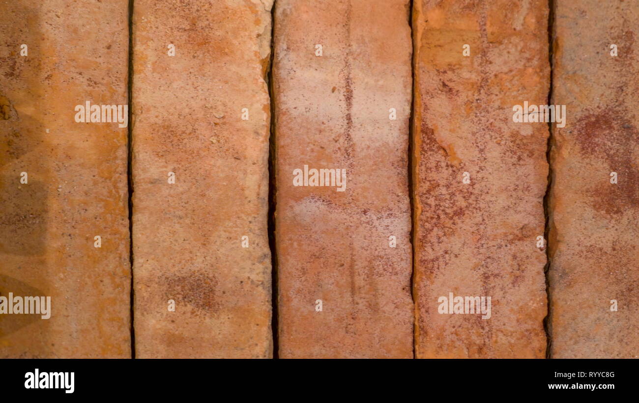 The red long bricks on pile in a store. A brick is building material ...