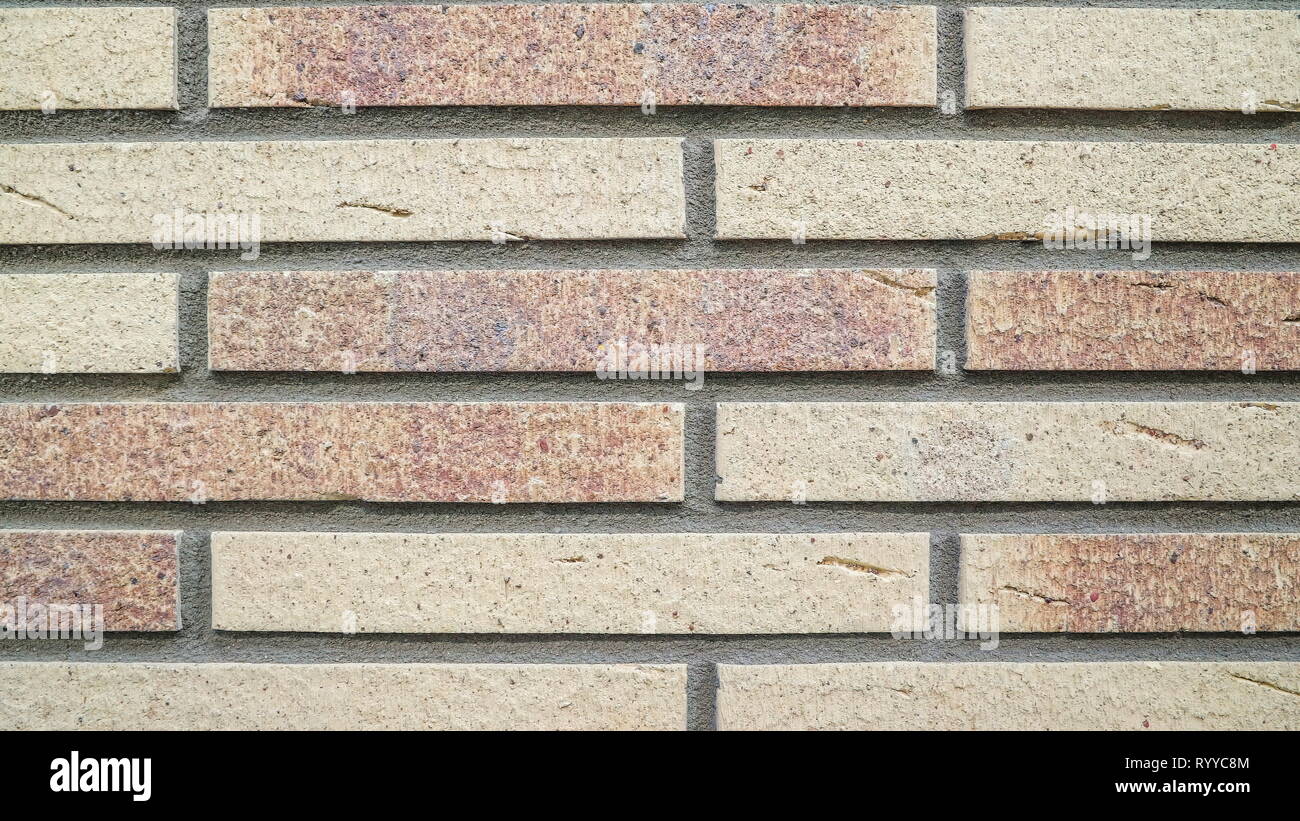 Long thin strips of bricks on the wall one of the many seen brick walls ...