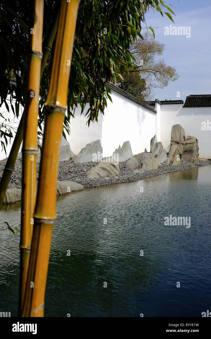 Rockery by the reflecting pool with bamboo forest in foreground in the ...