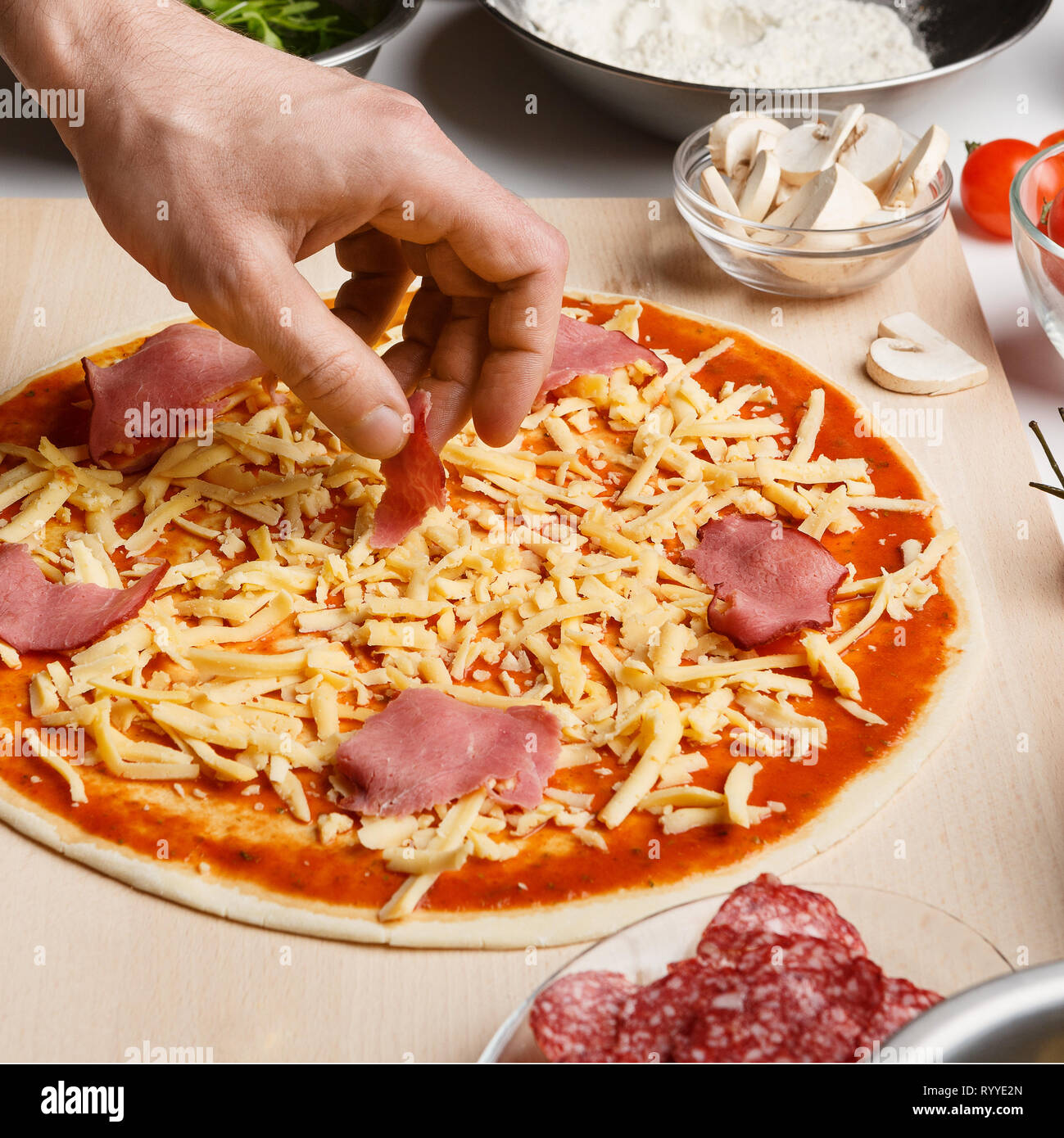 Pizza cheese man adding hi-res stock photography and images - Alamy
