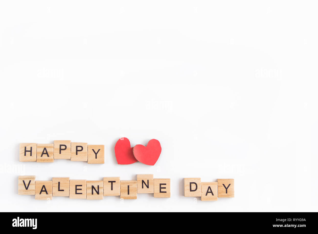 Alphabet letter wooden blocks tiles Valentine`s day on white background ...